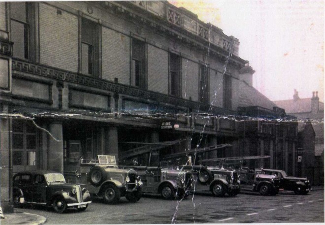 View of all 6 fire engines at the front of the fire station ...