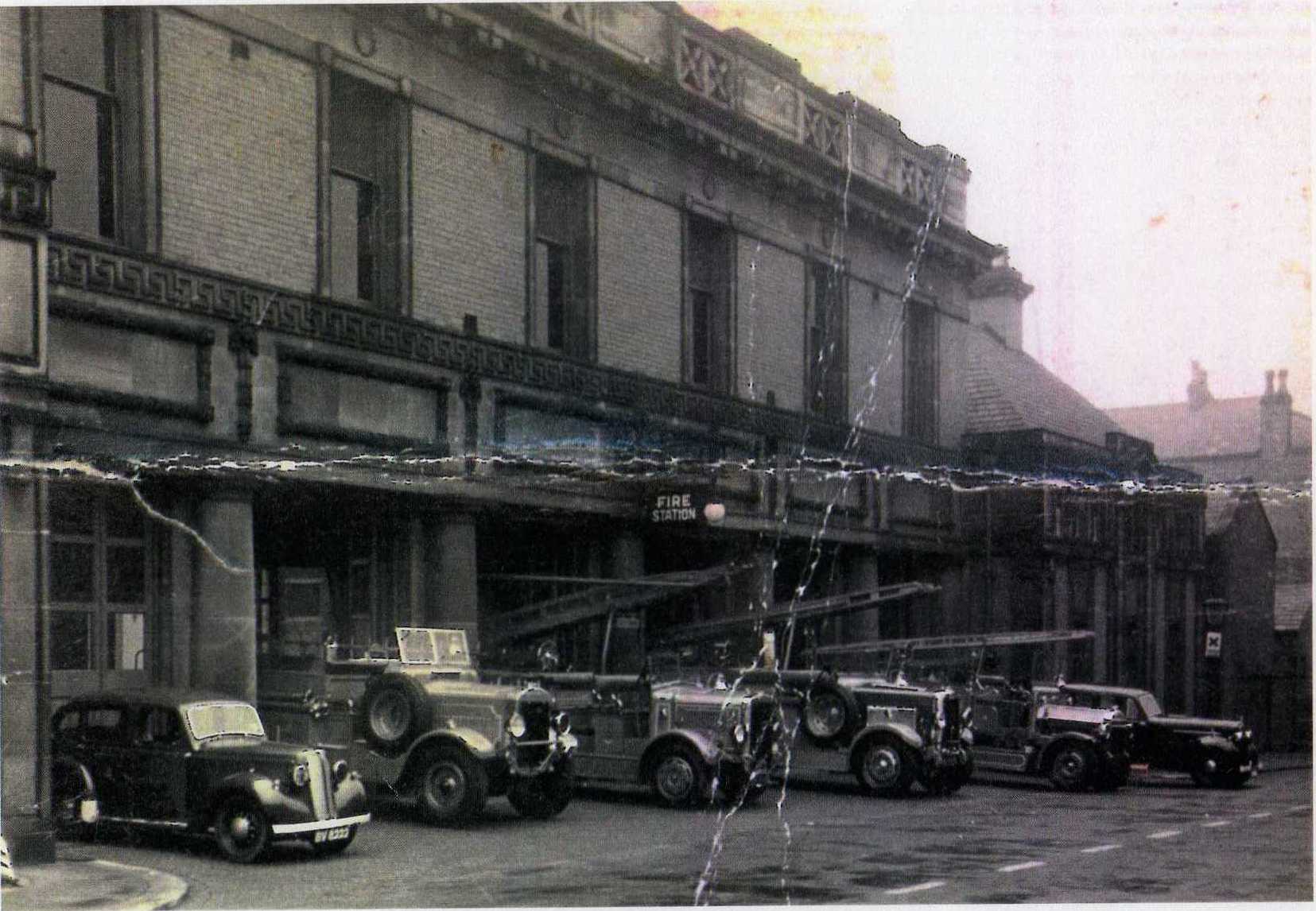 View of all 6 fire engines at the front of the fire station ...